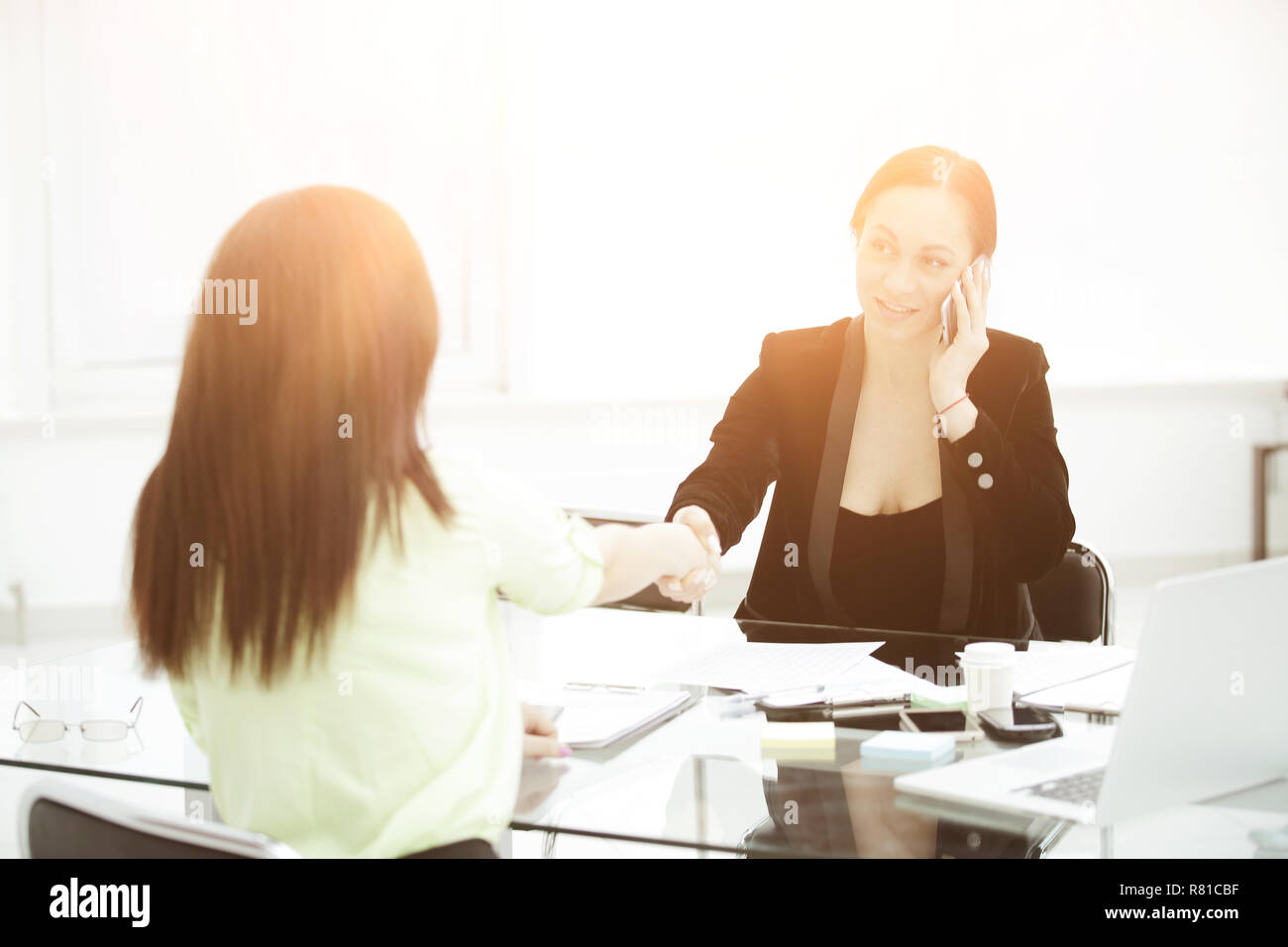 handshake Manager and client.women's power in business.photo with copy ...