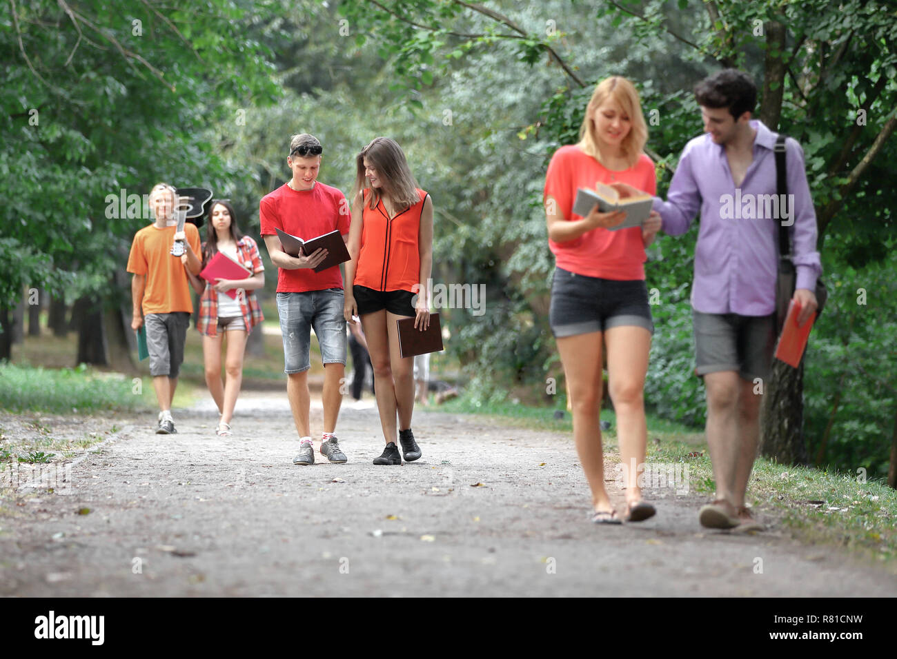 Group of College students on a walk in the Park Stock Photo - Alamy