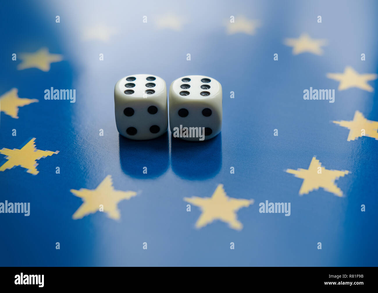 Two six dice on the symbol of the European Union Stock Photo - Alamy