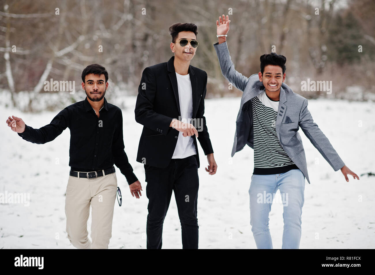 Group of three casual young indian mans posed at winter day having fun ...