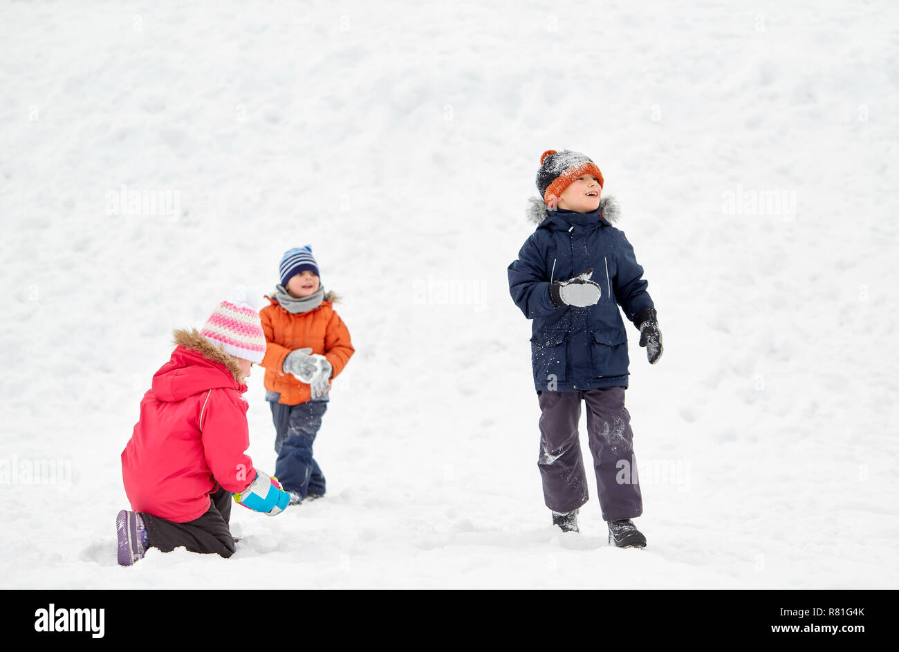 happy little kids playing outdoors in winter Stock Photo - Alamy