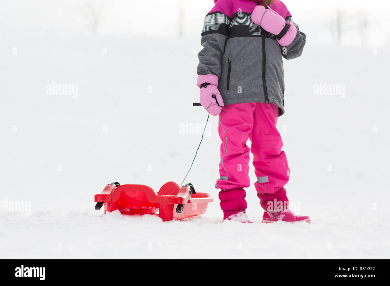 Girl and sled hi-res stock photography and images - Alamy