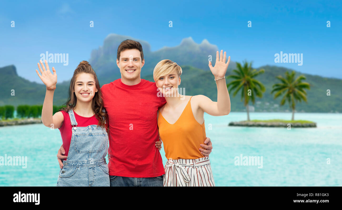 happy friends hugging over bora bora beach Stock Photo - Alamy