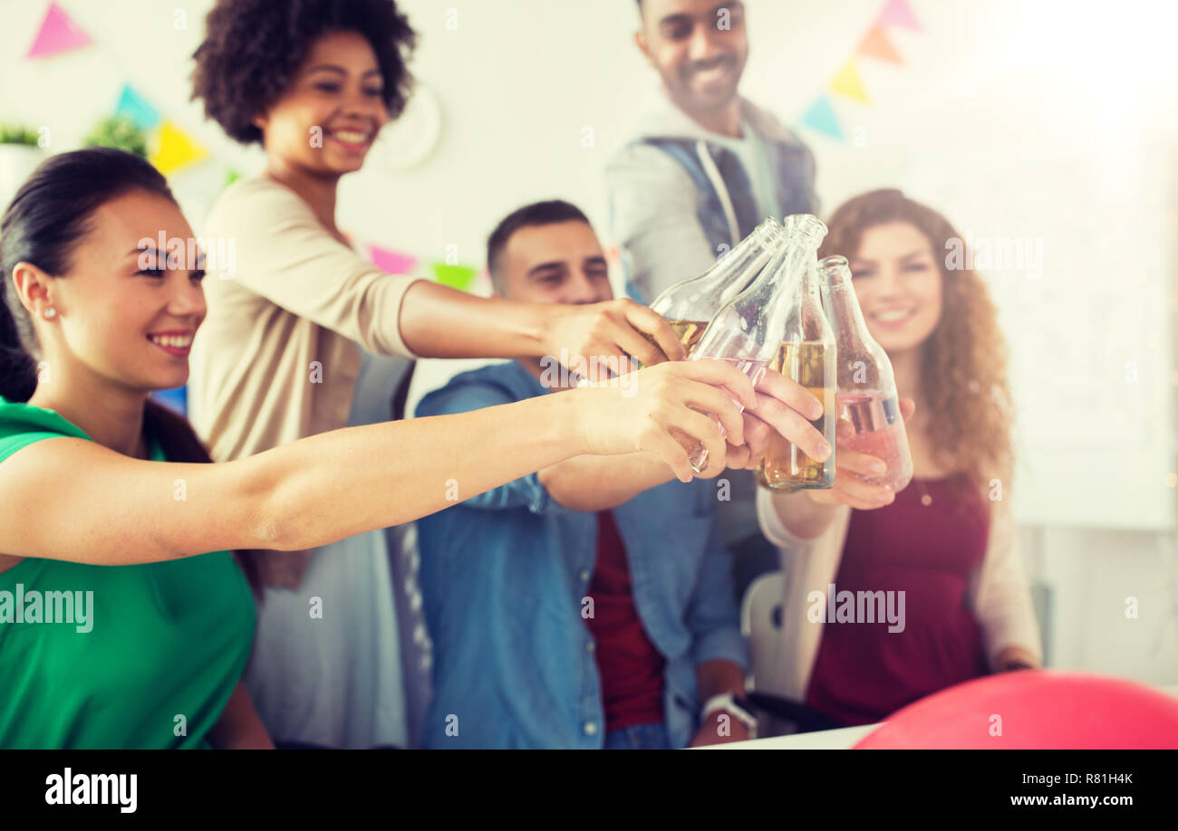 happy team with drinks celebrating at office party Stock Photo - Alamy