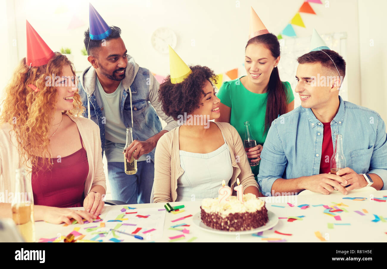 team greeting colleague at office birthday party Stock Photo - Alamy