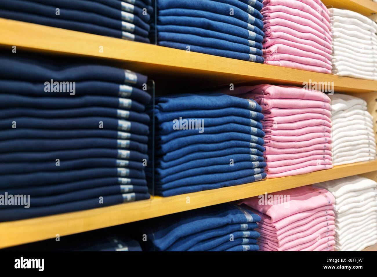 close up of shelves with clothes at clothing store Stock Photo - Alamy