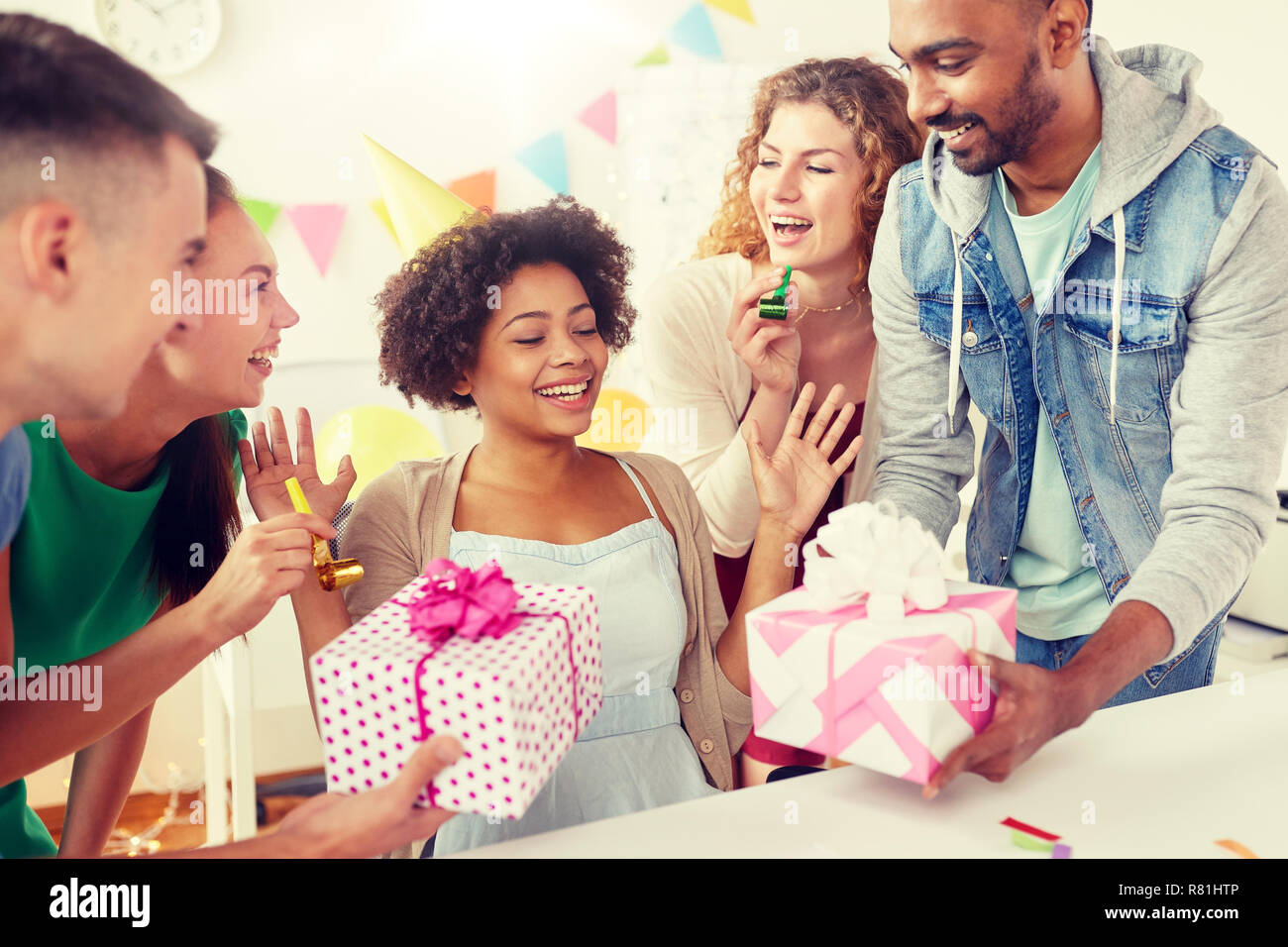 team greeting colleague at office birthday party Stock Photo - Alamy