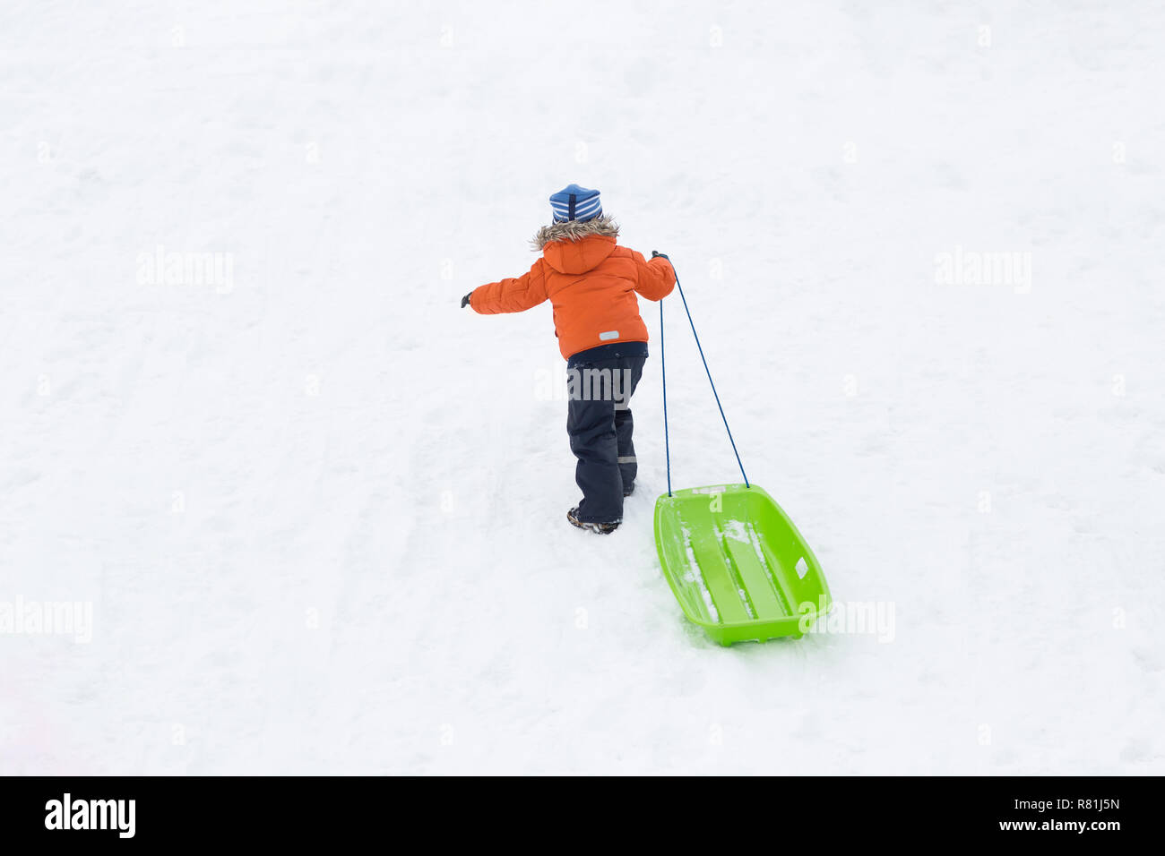 Boy pulling sledge hi-res stock photography and images - Alamy