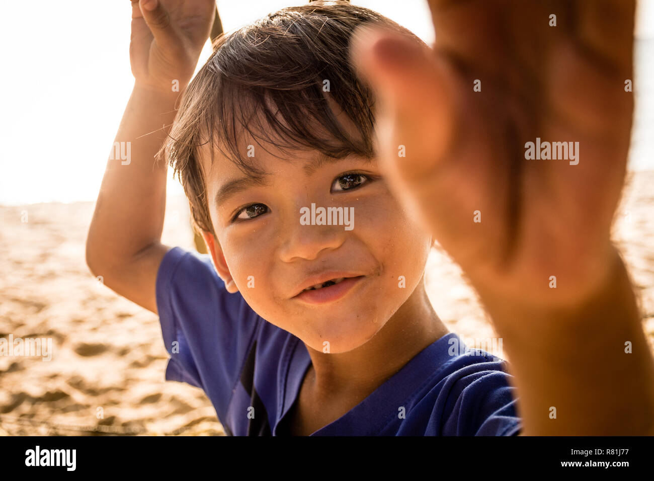 Child grabbing at camera hi-res stock photography and images - Alamy