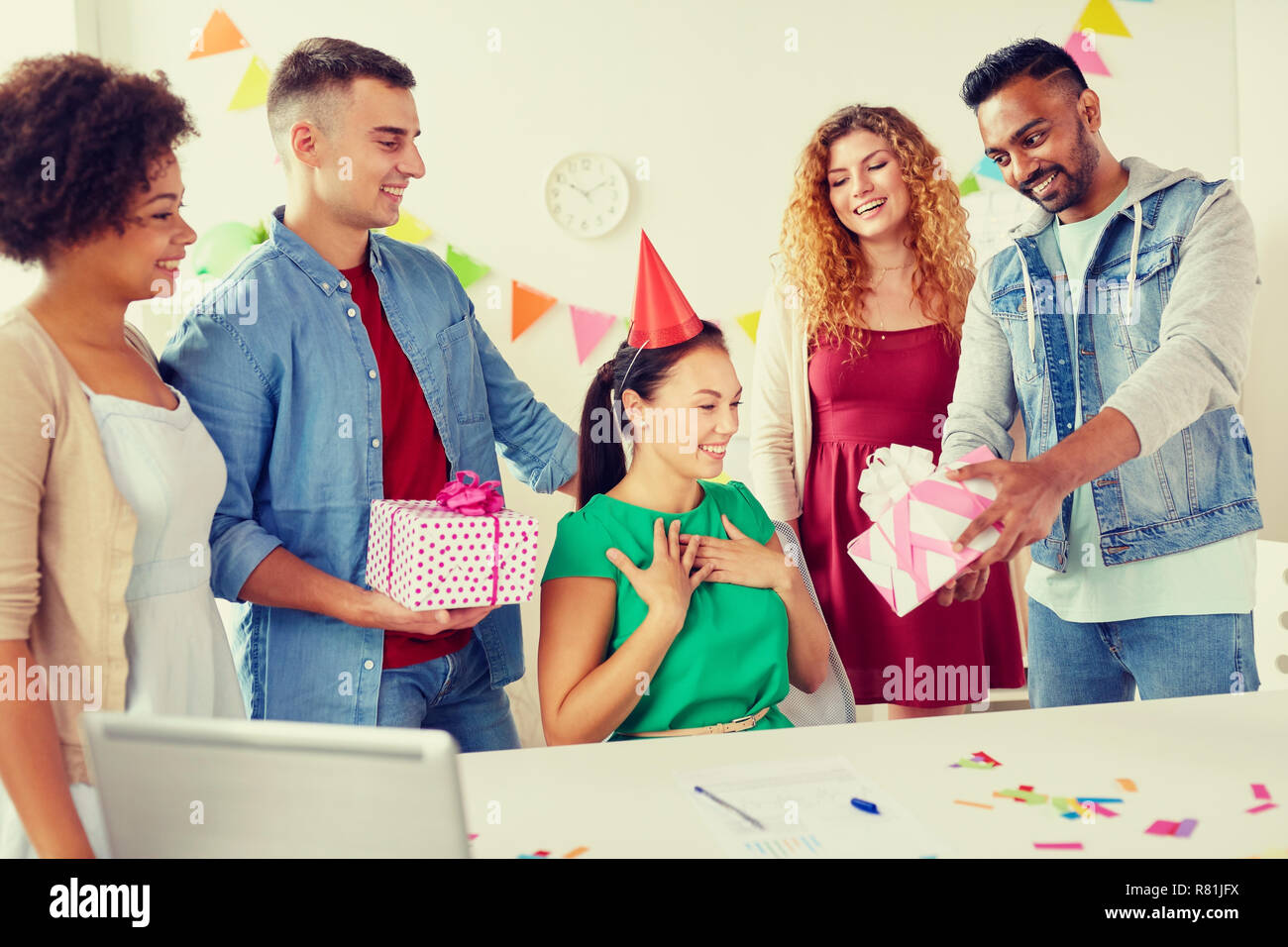 team greeting colleague at office birthday party Stock Photo - Alamy