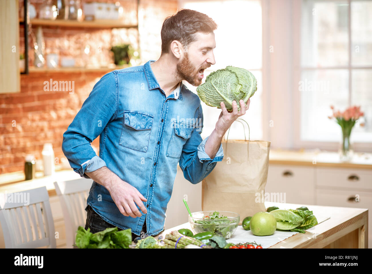 Man holding cabbage hi-res stock photography and images - Alamy
