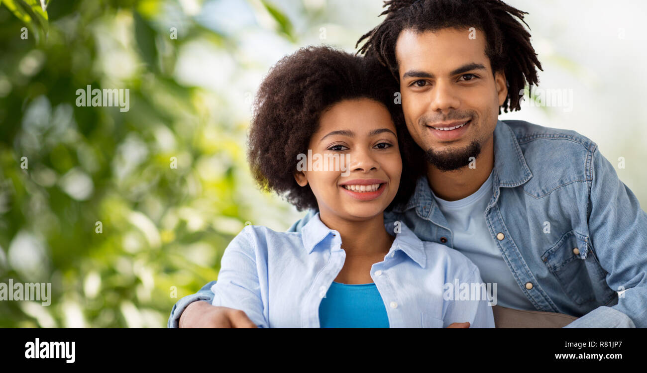 happy african american couple hugging Stock Photo - Alamy