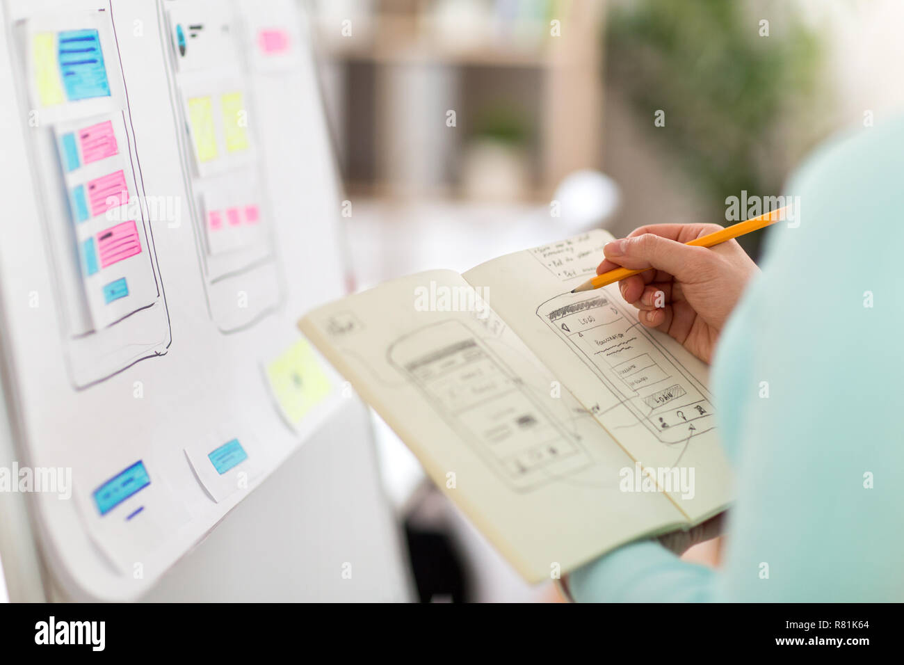 ui designer with user interface sketch in notebook Stock Photo - Alamy