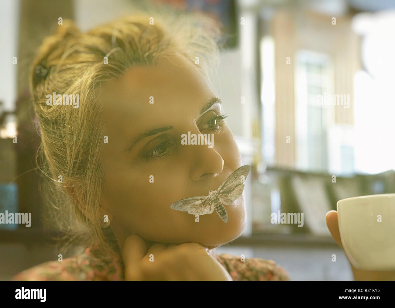 beauty woman with chrysalis on the lips Stock Photo - Alamy