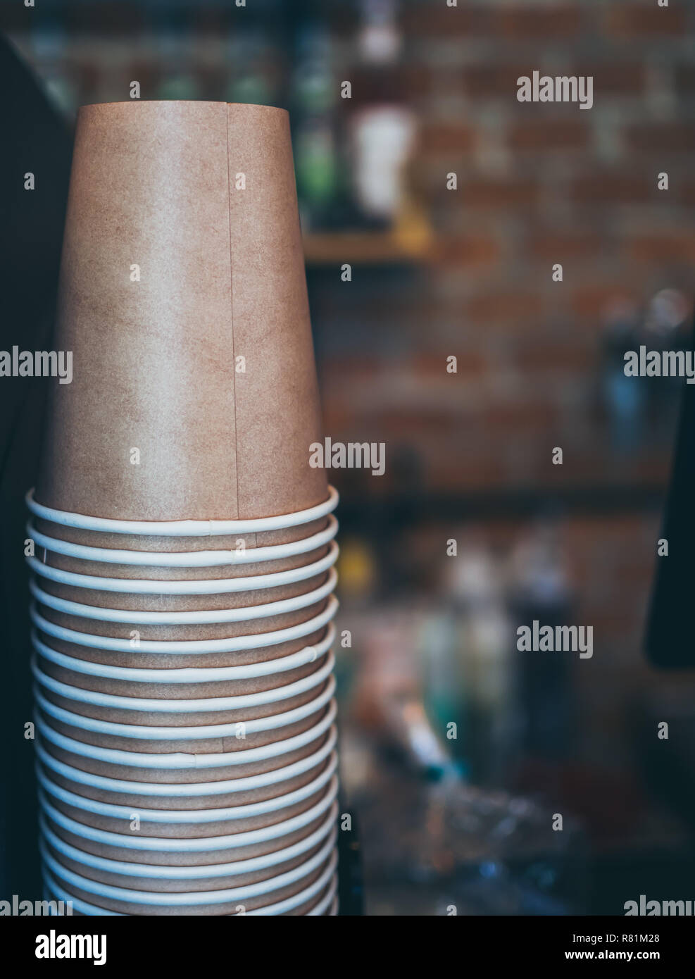 Stack of small brown paper cups made of craft paper prepared for coffee ...