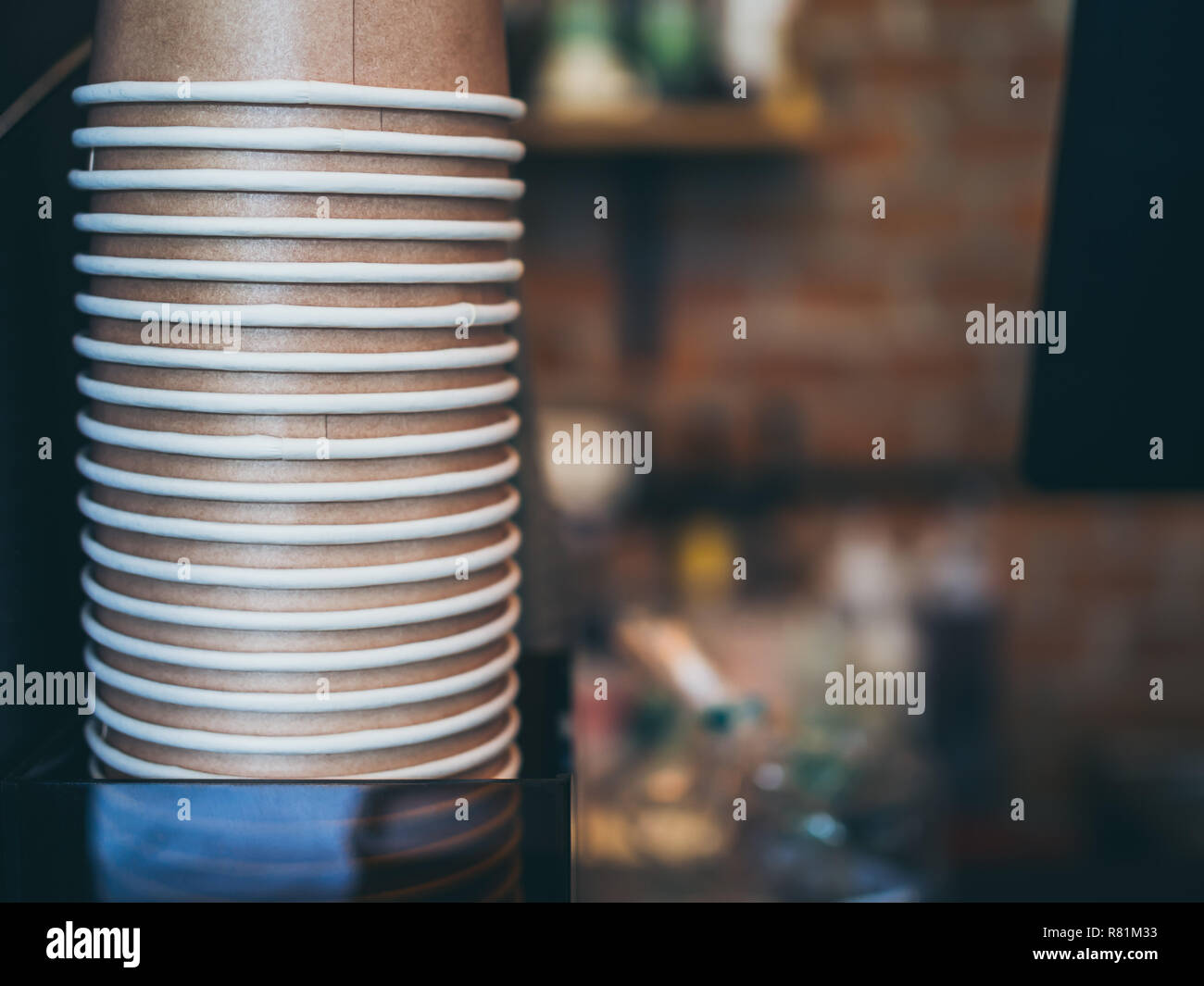 Stack of small brown paper cups made of craft paper prepared for coffee ...
