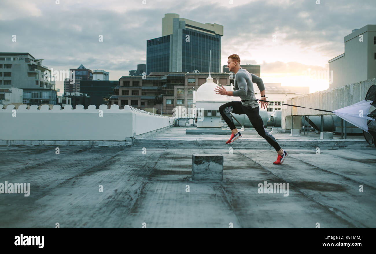 Man running on rooftop hi-res stock photography and images - Alamy