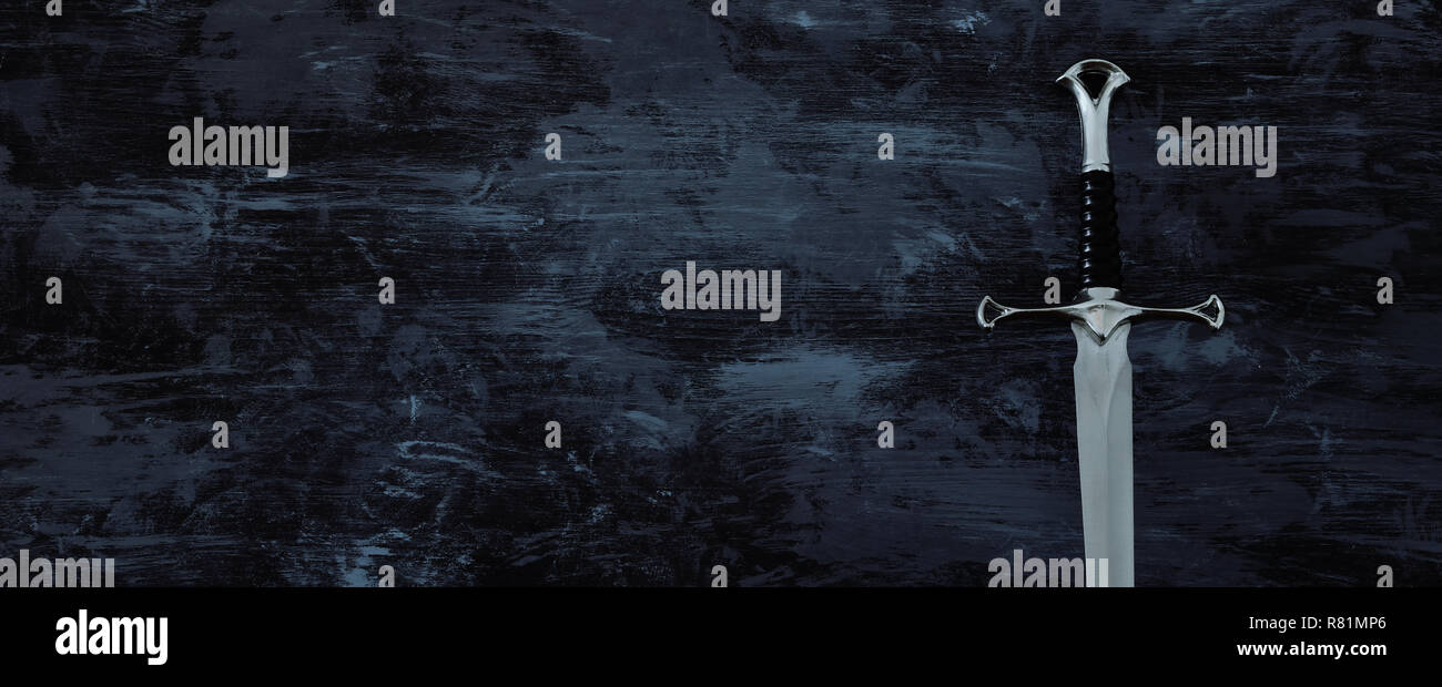 low key banner of silver sword. fantasy medieval period Stock Photo - Alamy