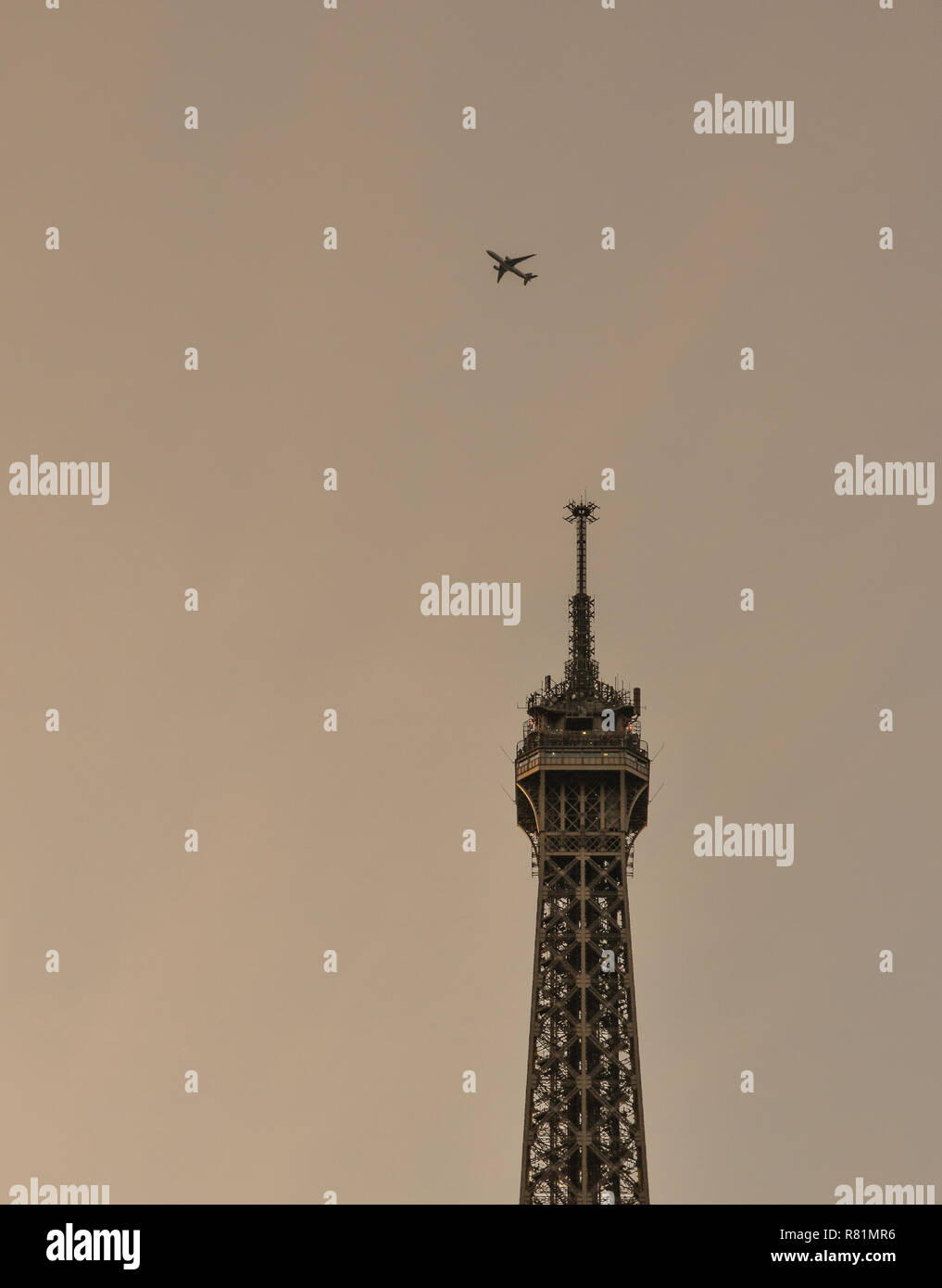 Airplane flying over Eiffel Tower in Paris, France Stock Photo - Alamy