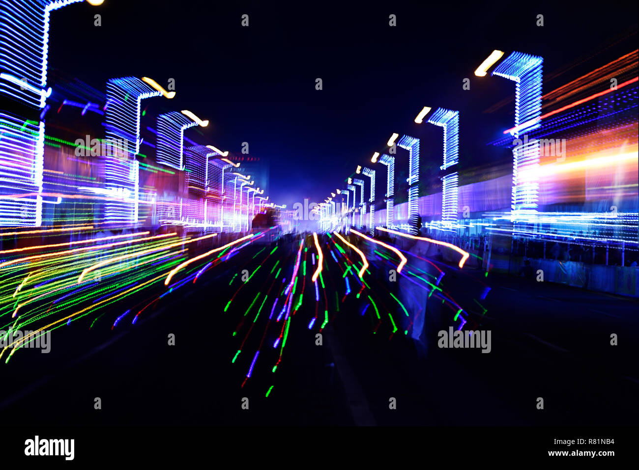 Car moving on highway against dark night, photograph is taken with long ...