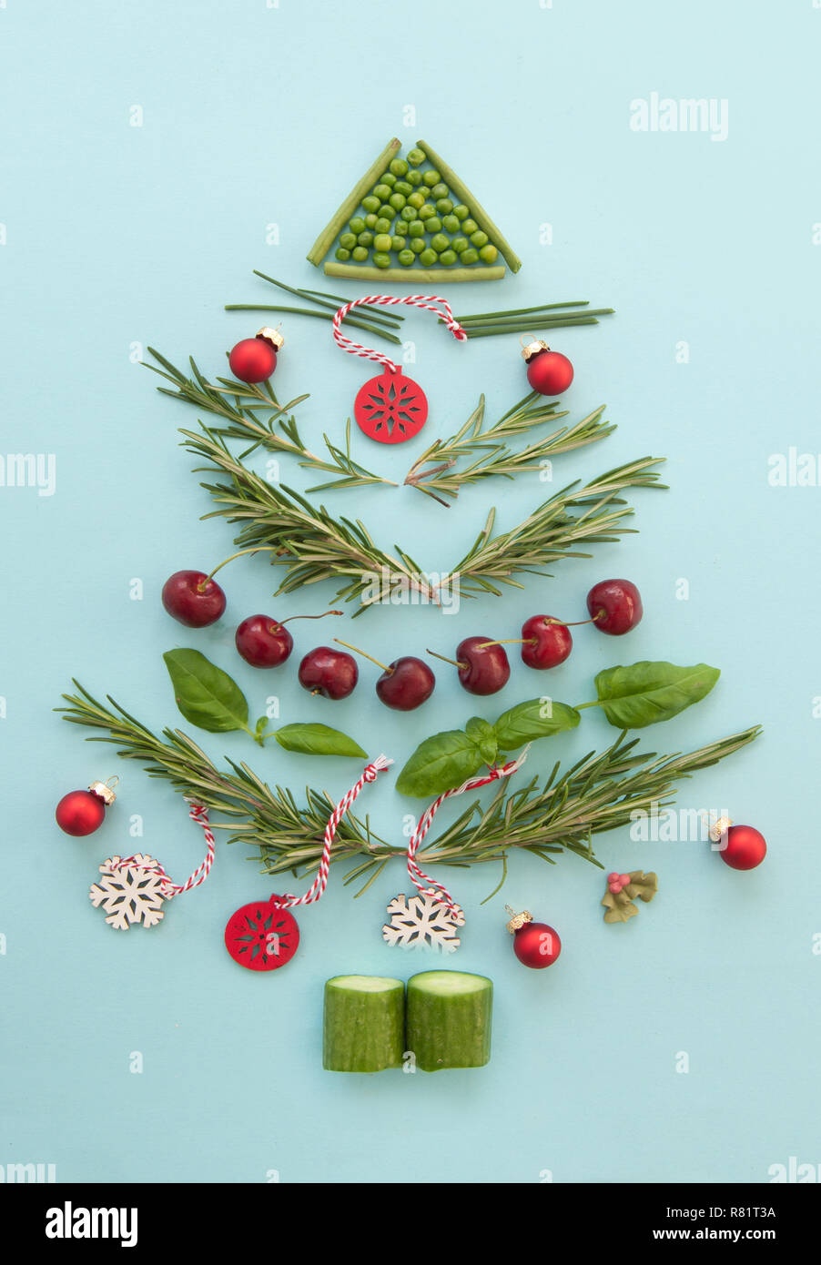 Christmas tree made from food ingredients with decorations including ...