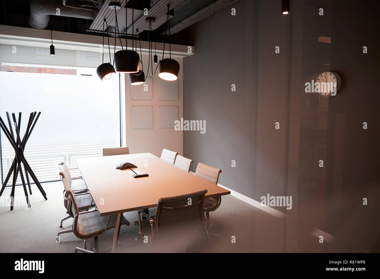 Chairs Around Boardroom Table In Empty Modern Meeting Room Stock Photo - Alamy