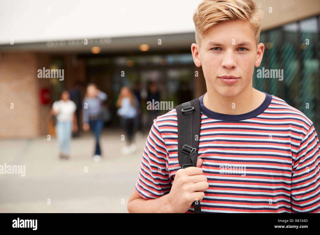 Portrait Of Serious Male High School Student Outside College Building ...