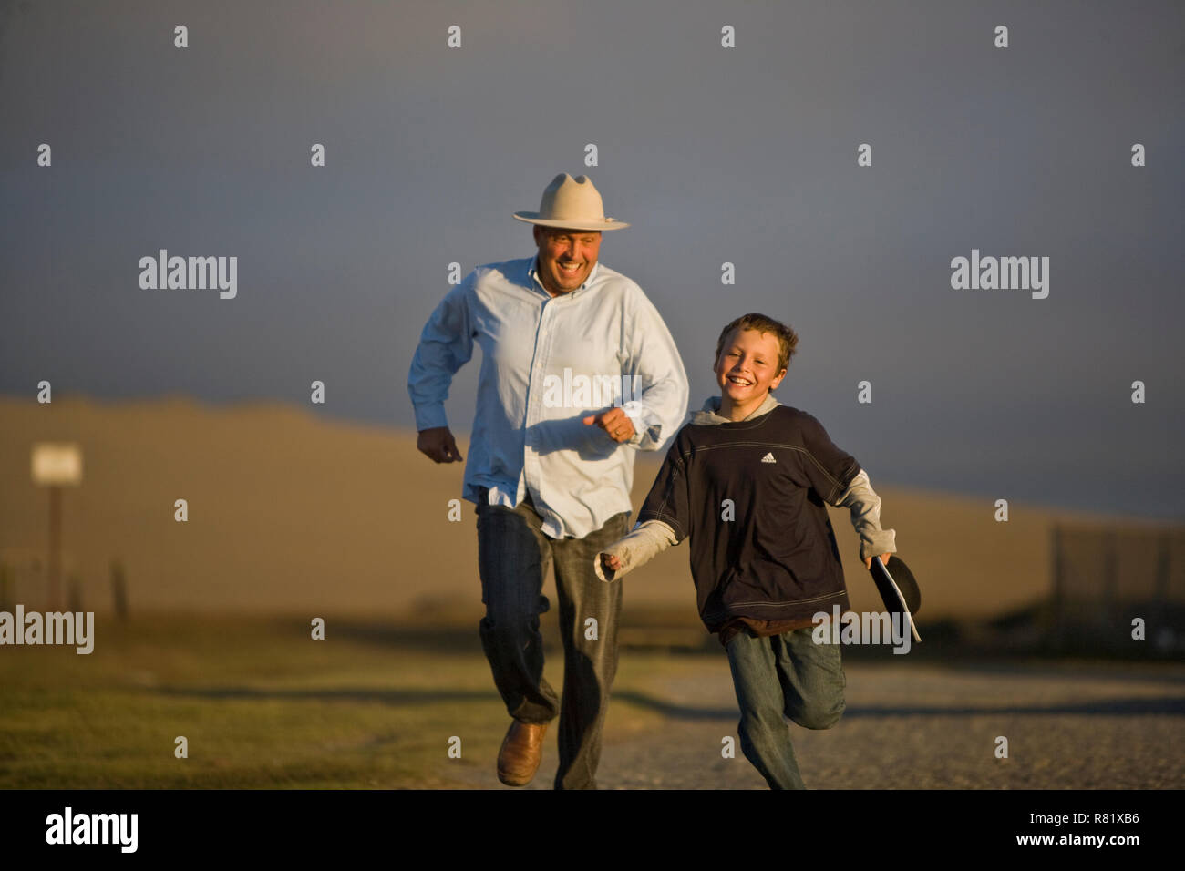 Father and son running Stock Photo - Alamy