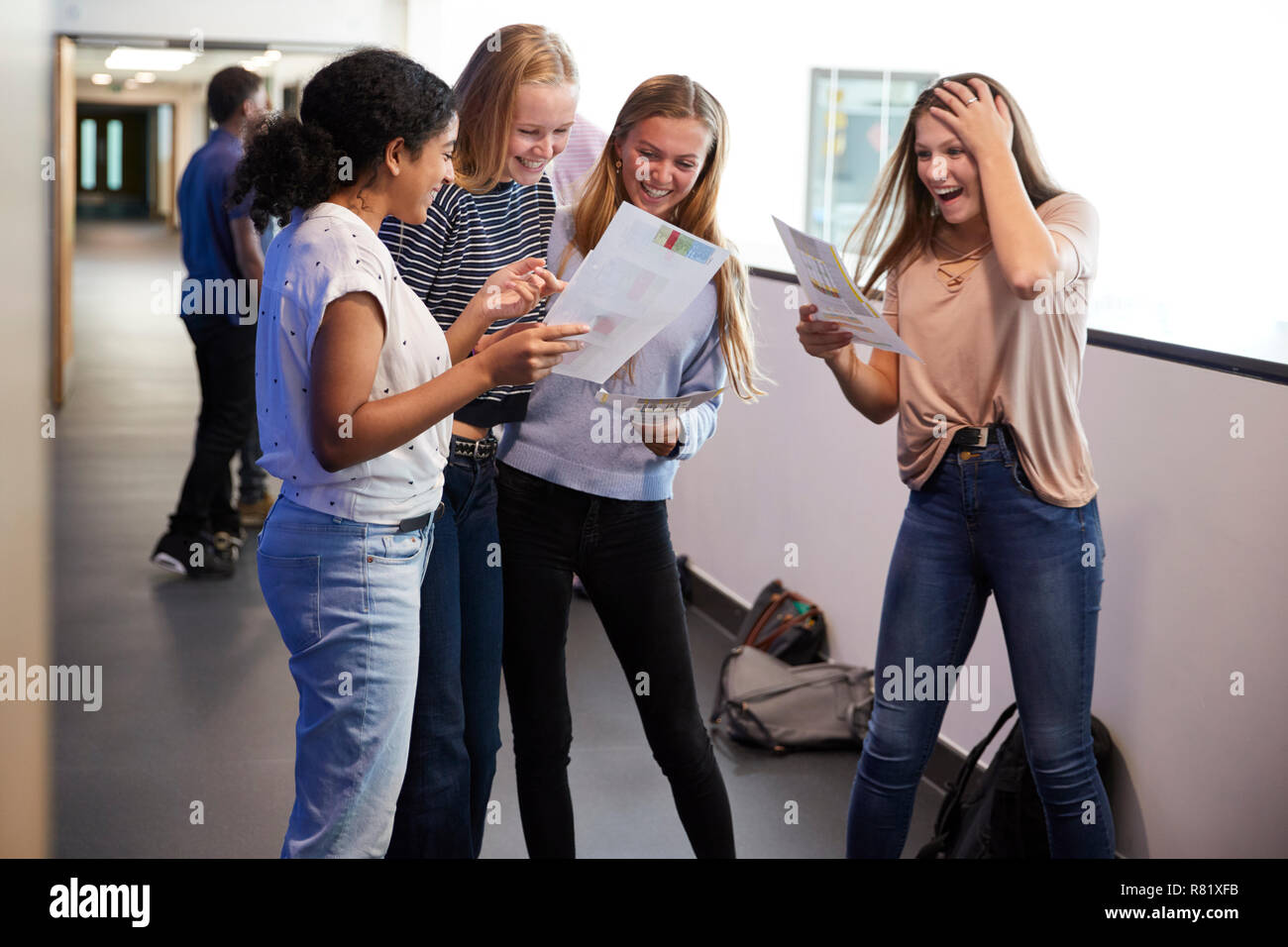 Excited Female Teenage High School Students Celebrating Exam Results In ...