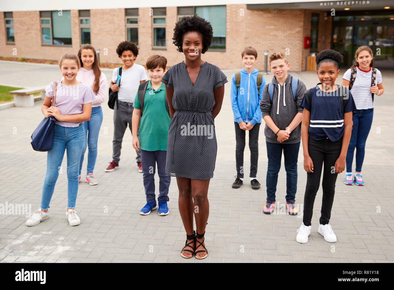 Portrait Of Smiling High School Student Group With Female Teacher ...