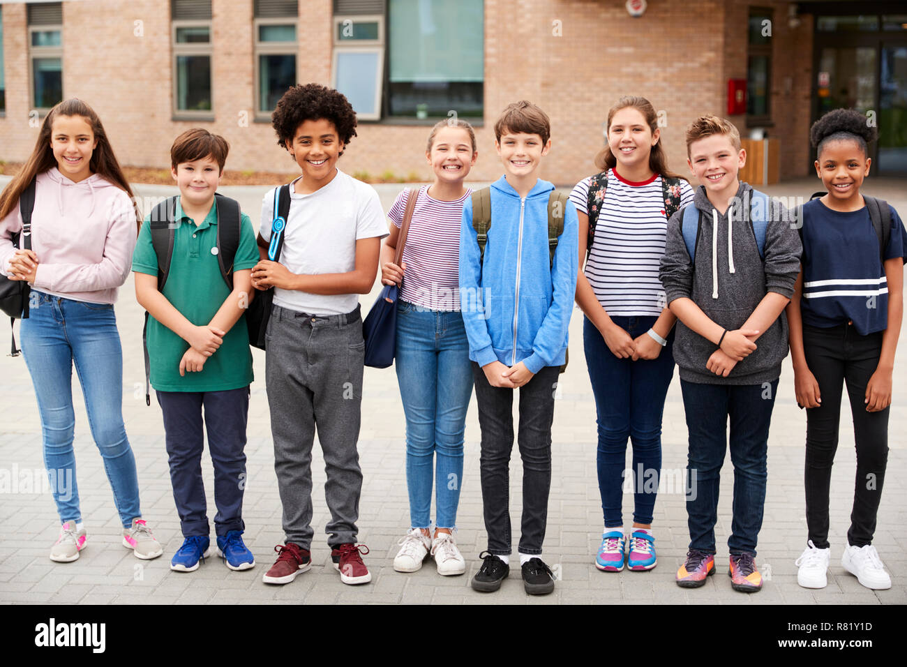 Portrait Of High School Student Group Standing Outside School Buildings ...