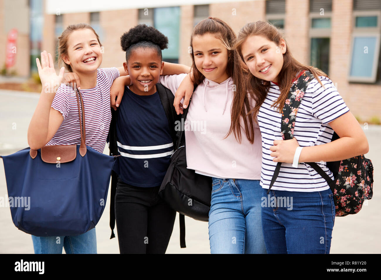 Portrait Of Female High School Student Friends Standing Outside School ...