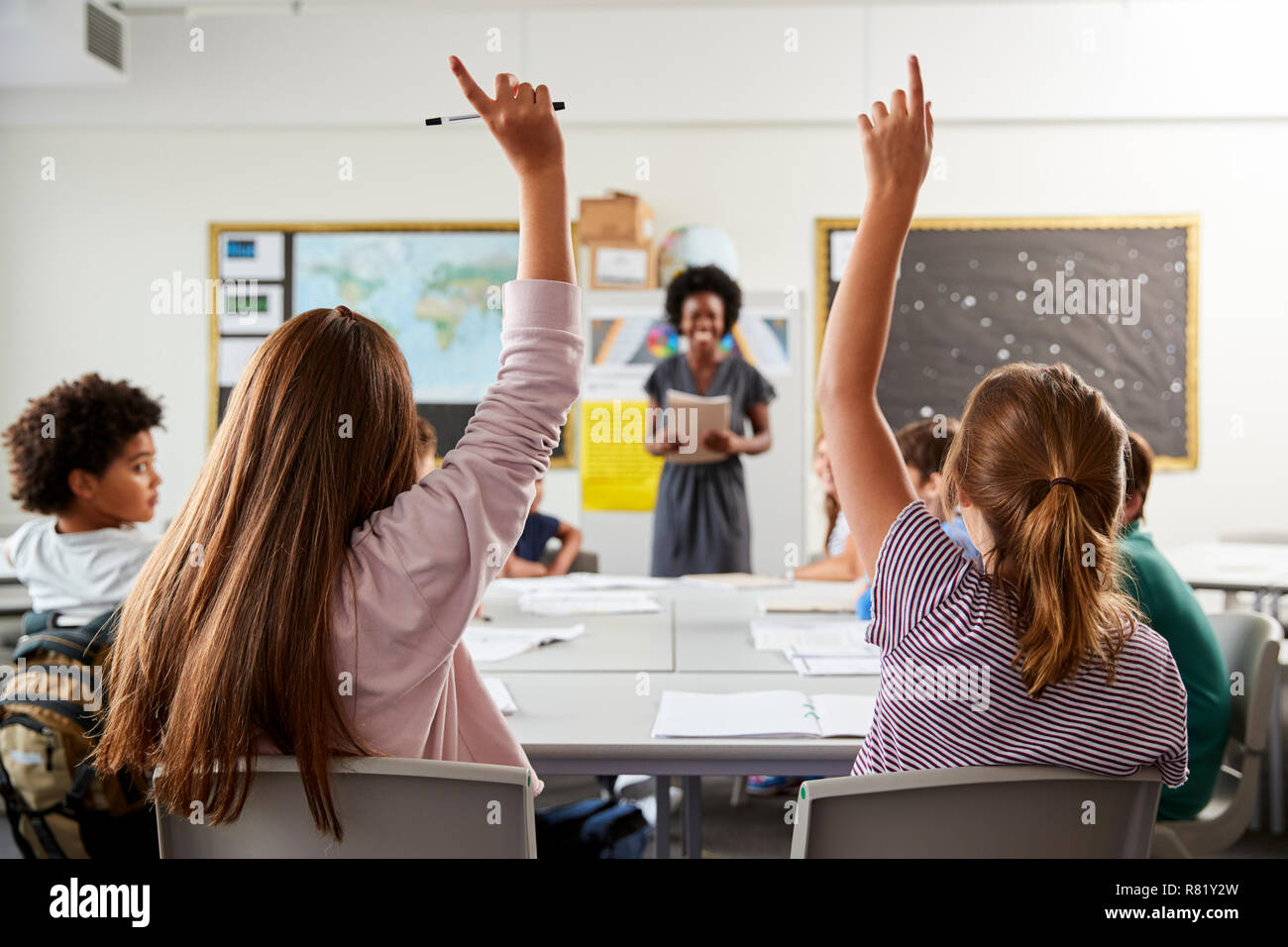 High School Students Raising Their Hands