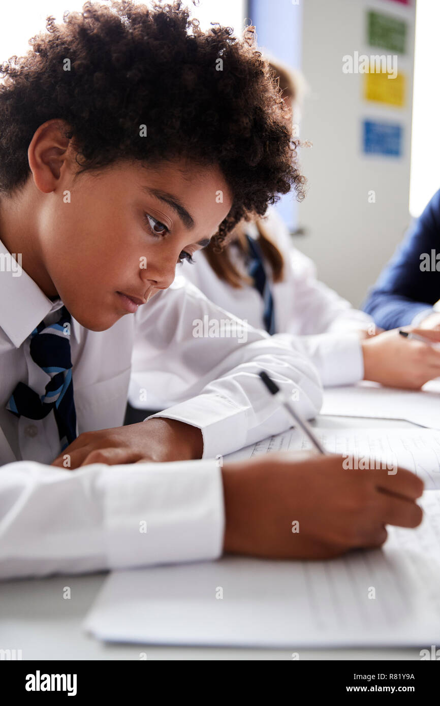 Student sitting table writing hi-res stock photography and images - Alamy