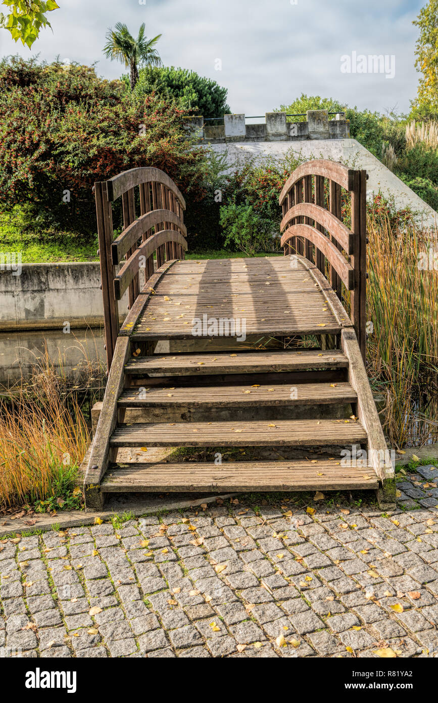 Beautiful wooden bridge across river Stock Photo - Alamy