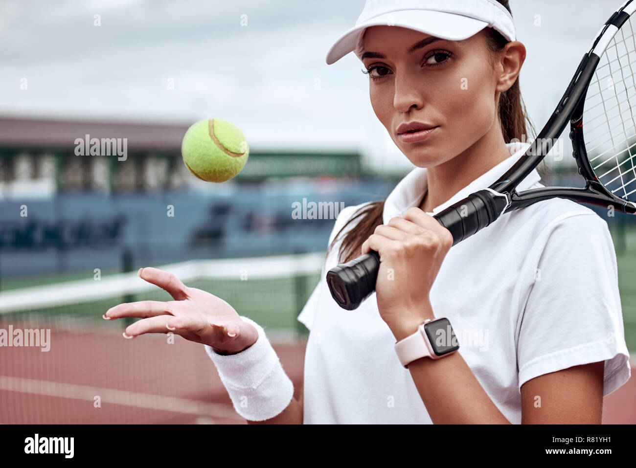 Young girl hitting tennis ball hi-res stock photography and images - Alamy