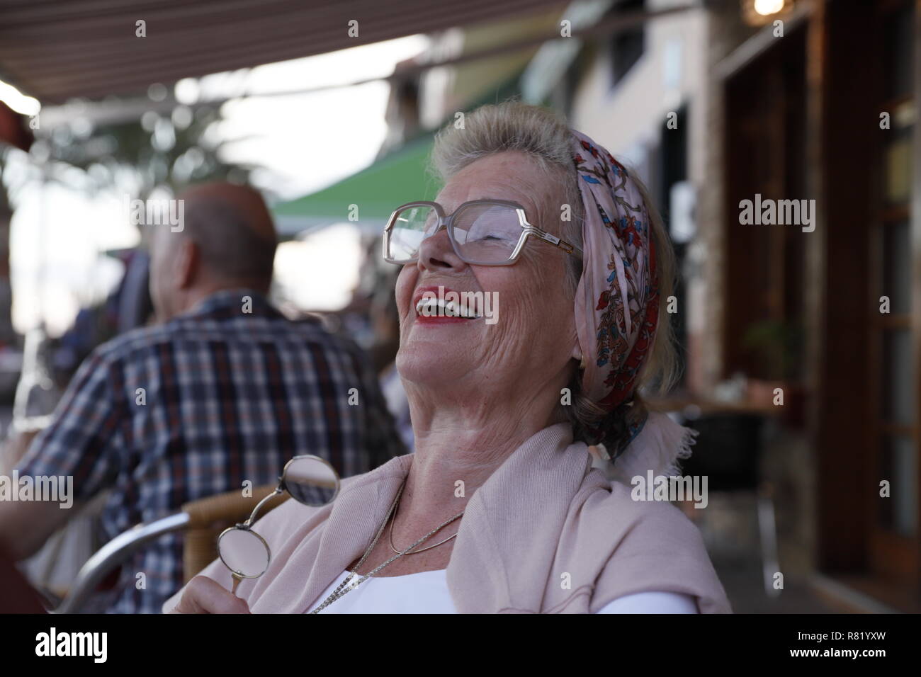 Attractive 78 year old woman during a summer restaurant visit ...