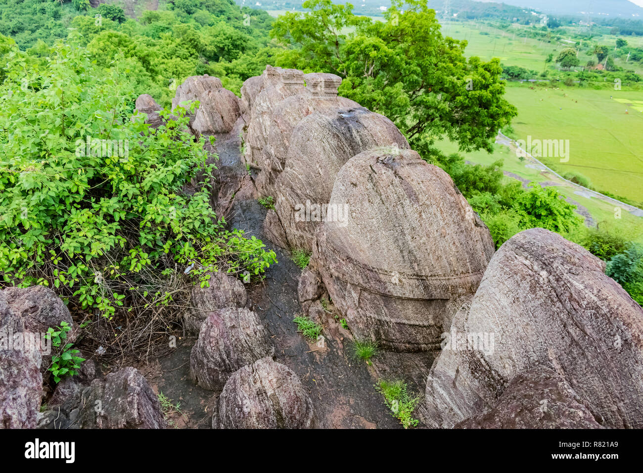 top view of circular shaped big rock at top of a hills looking good ...