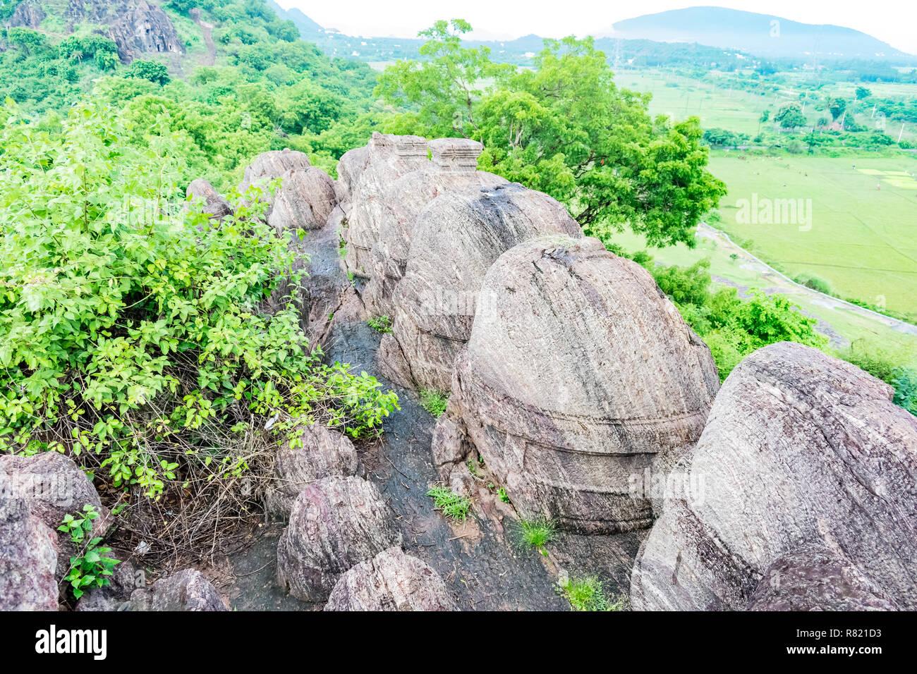 top view of circular shaped big rock at top of a hills looking good ...