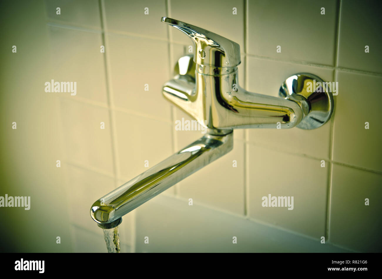 a silver water tap in the bathroom Stock Photo - Alamy