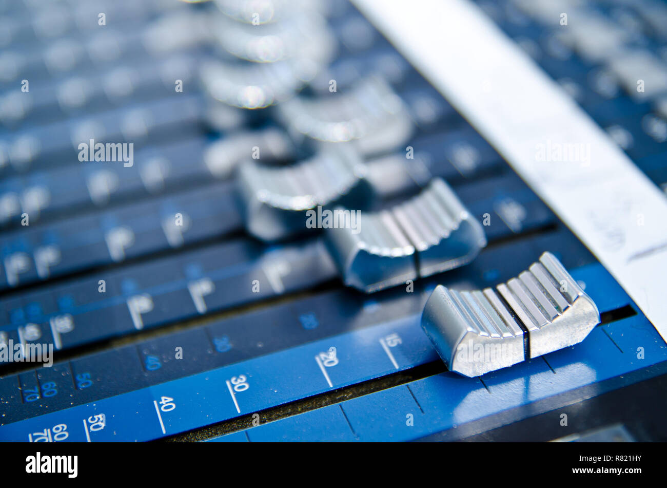 blue sound music mixer control panel closeup Stock Photo - Alamy