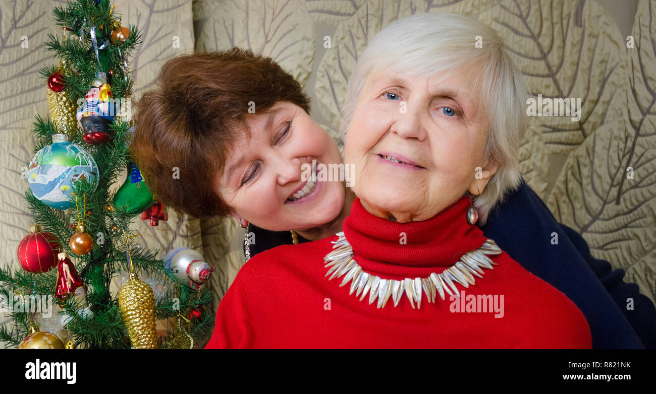 Family moments at Christmas time. old woman smile. grandmother and her ...