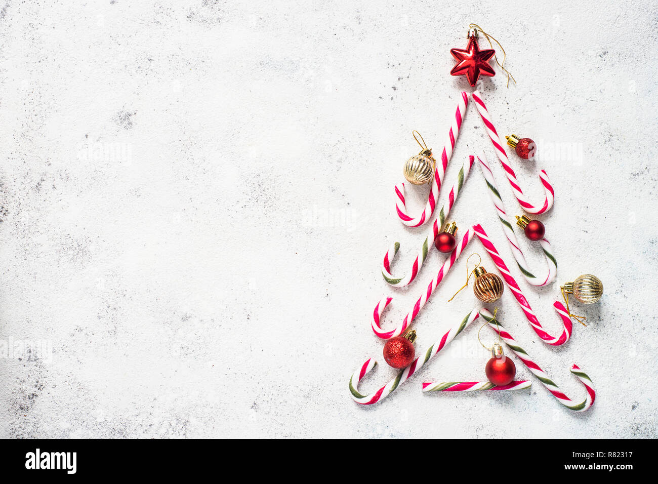 Creative fir tree made from candy and decorations Stock Photo - Alamy