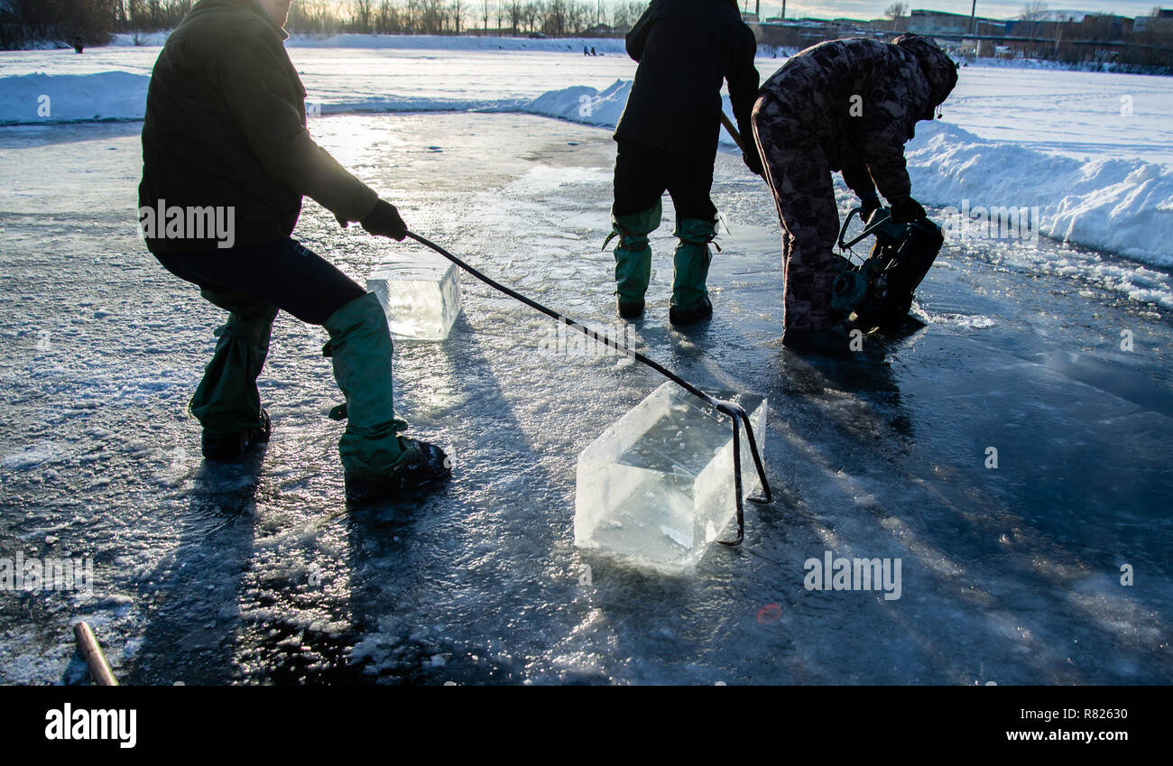 workers mine large cubes of natural river ice 'Ice Miners' Stock Photo ...
