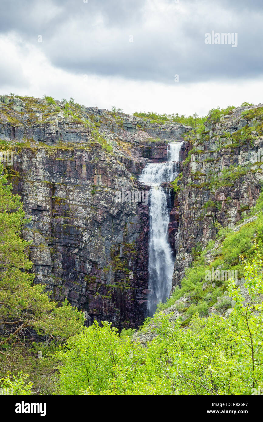 High waterfall on a mountain falling into a canyon Stock Photo - Alamy
