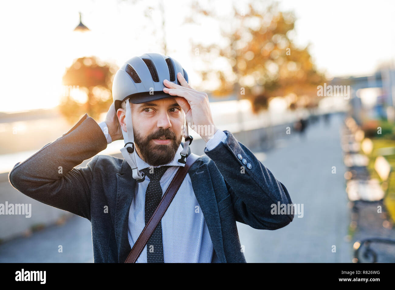 Worker putting on a jacket hi-res stock photography and images - Alamy