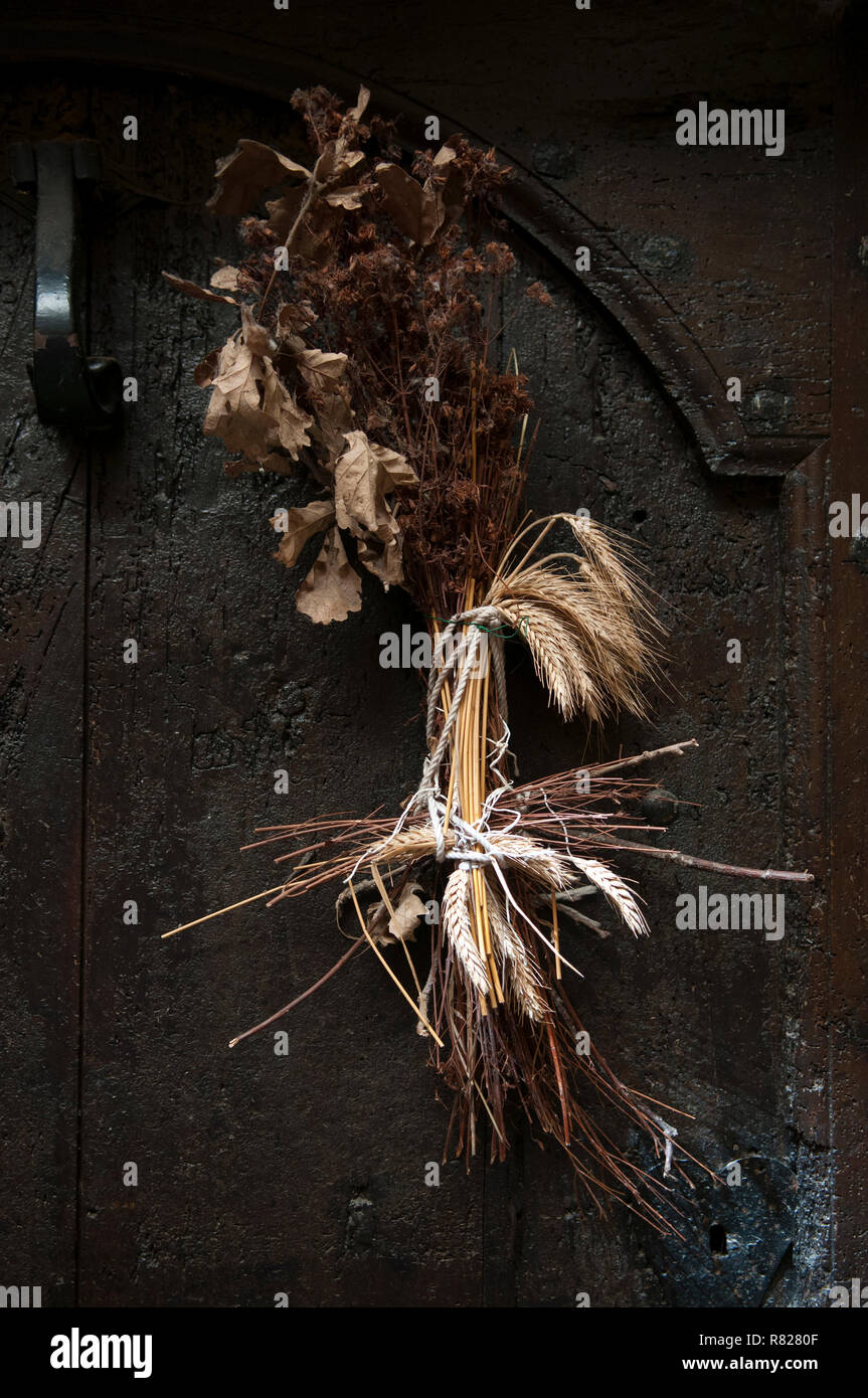 A Totem of Dried Flowers Attached to an Old Wooden Door in France Stock ...