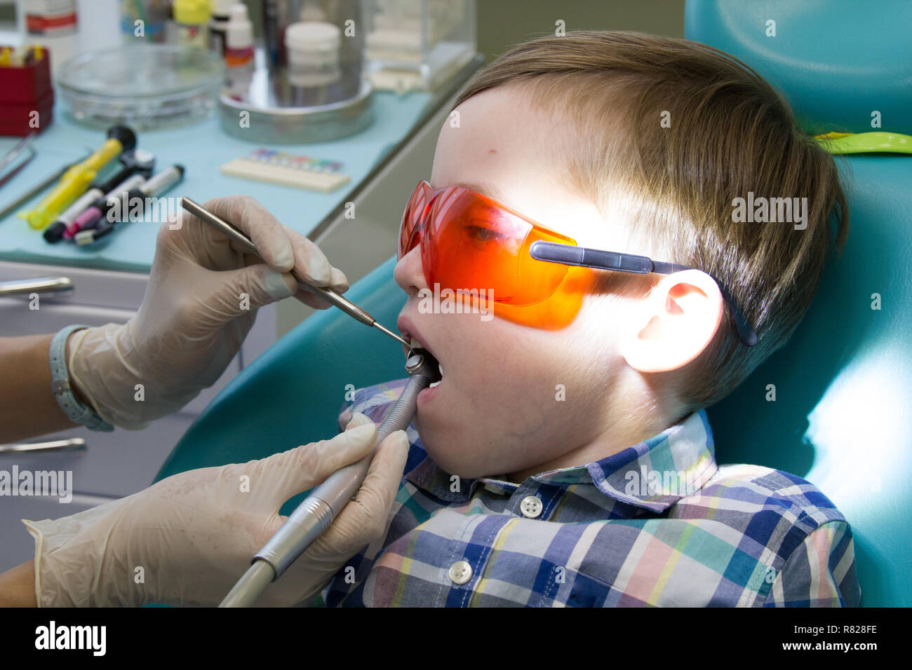 Reception at the dentistry. The dentist examines the oral cavity. Close ...