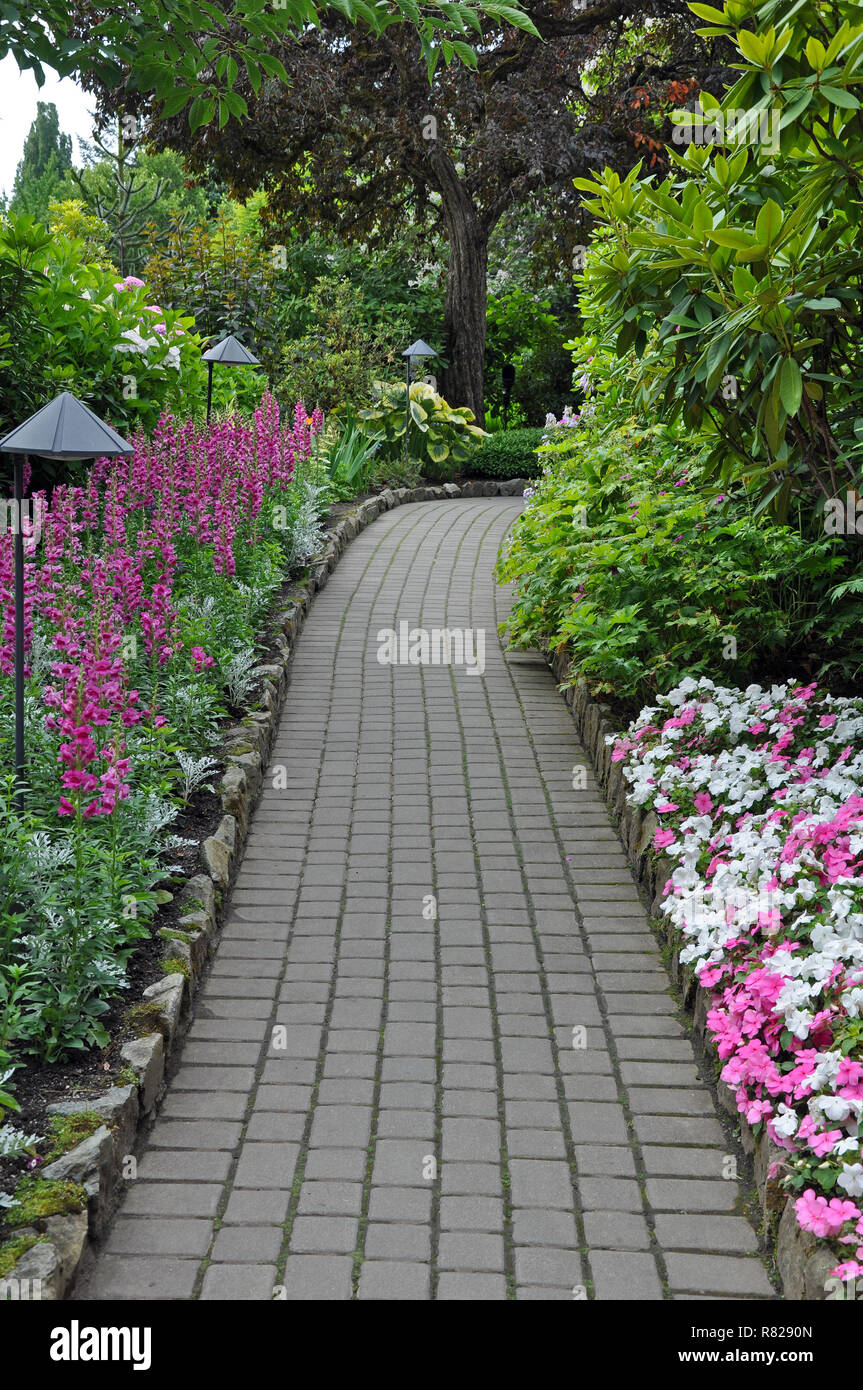 Beautiful spring garden pathway Stock Photo - Alamy