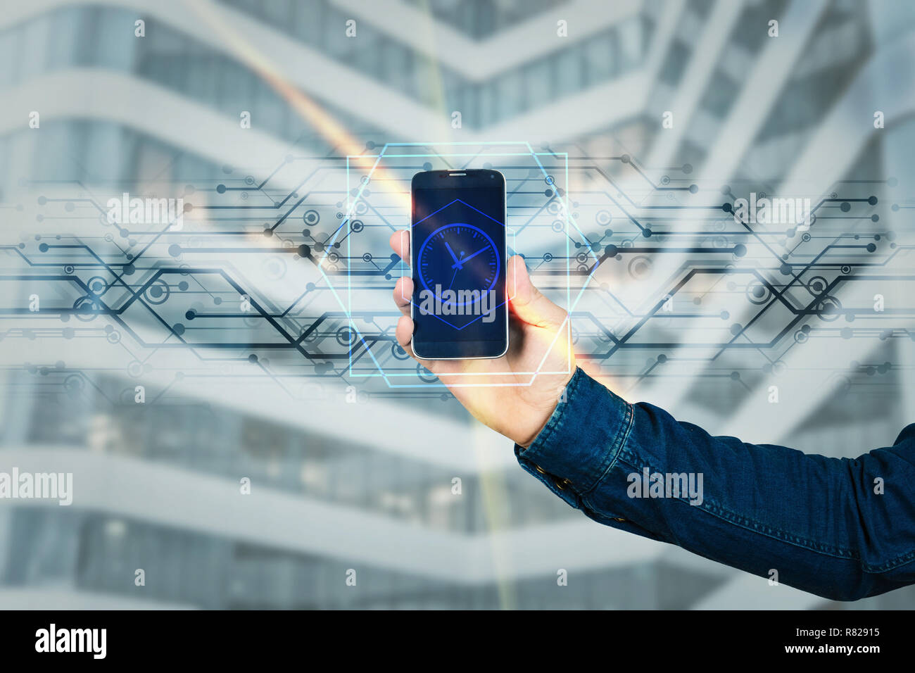 Man hand jeans jacket holding a smart cell phone with digital clock ...